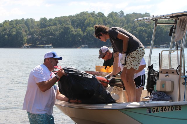 PHOTOS: Dozens in Dawson area join cleanup efforts for Lake Lanier ...